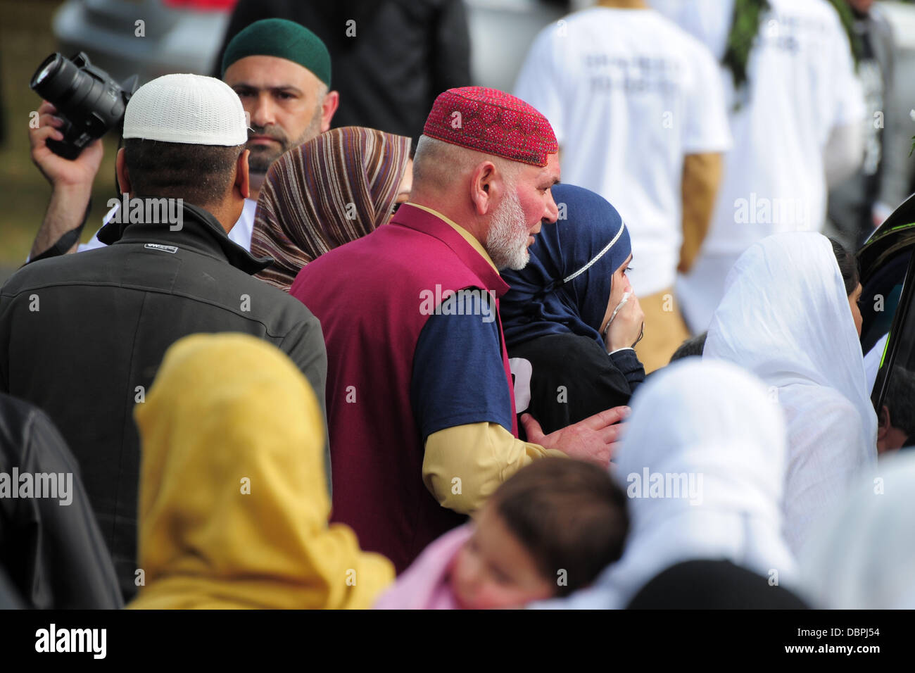 Atmosphere Family and friends are comforted by the hearses during the ...