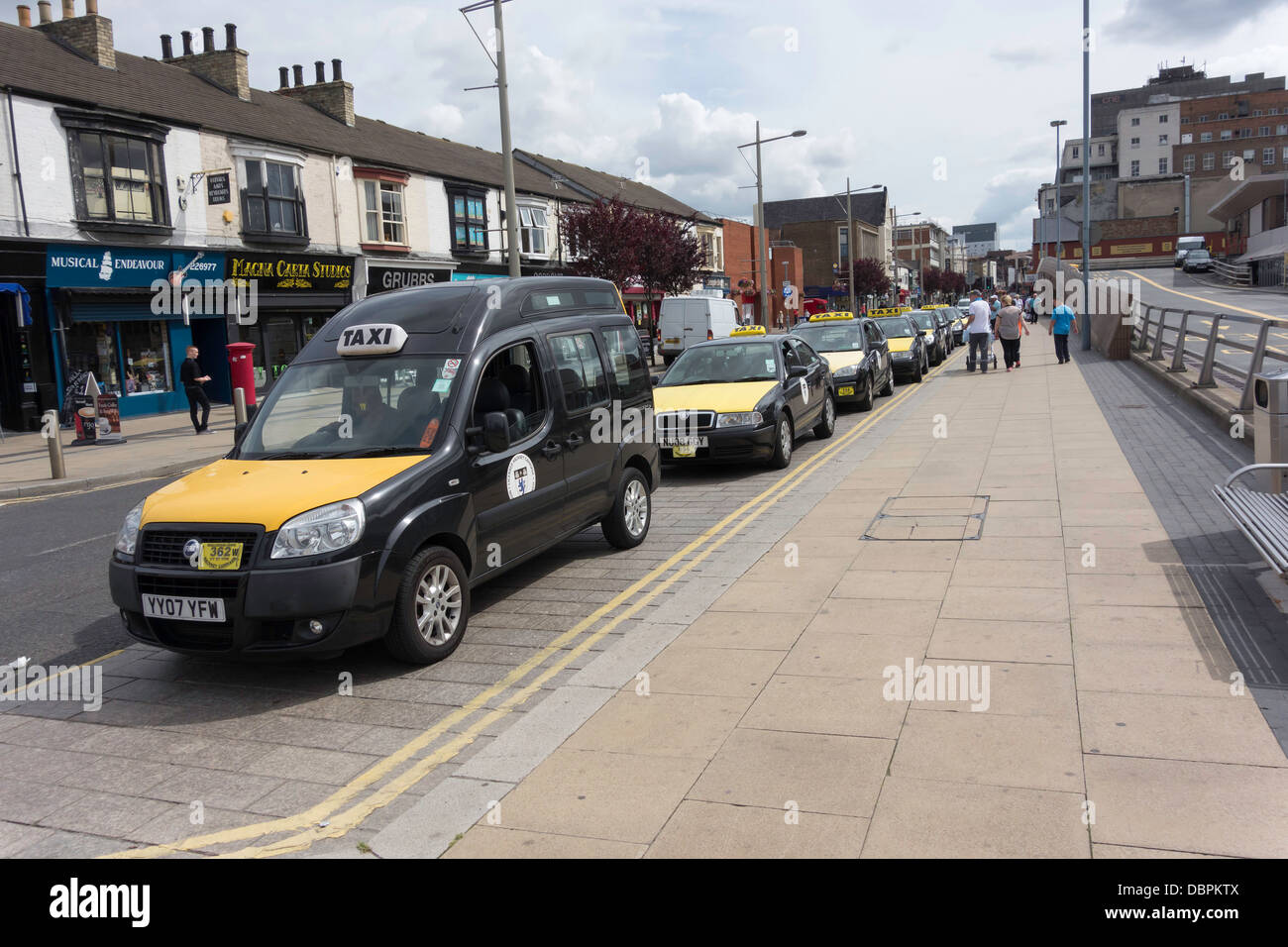 Black and yellow taxi cabs waiting on the rank at Newport Road ...