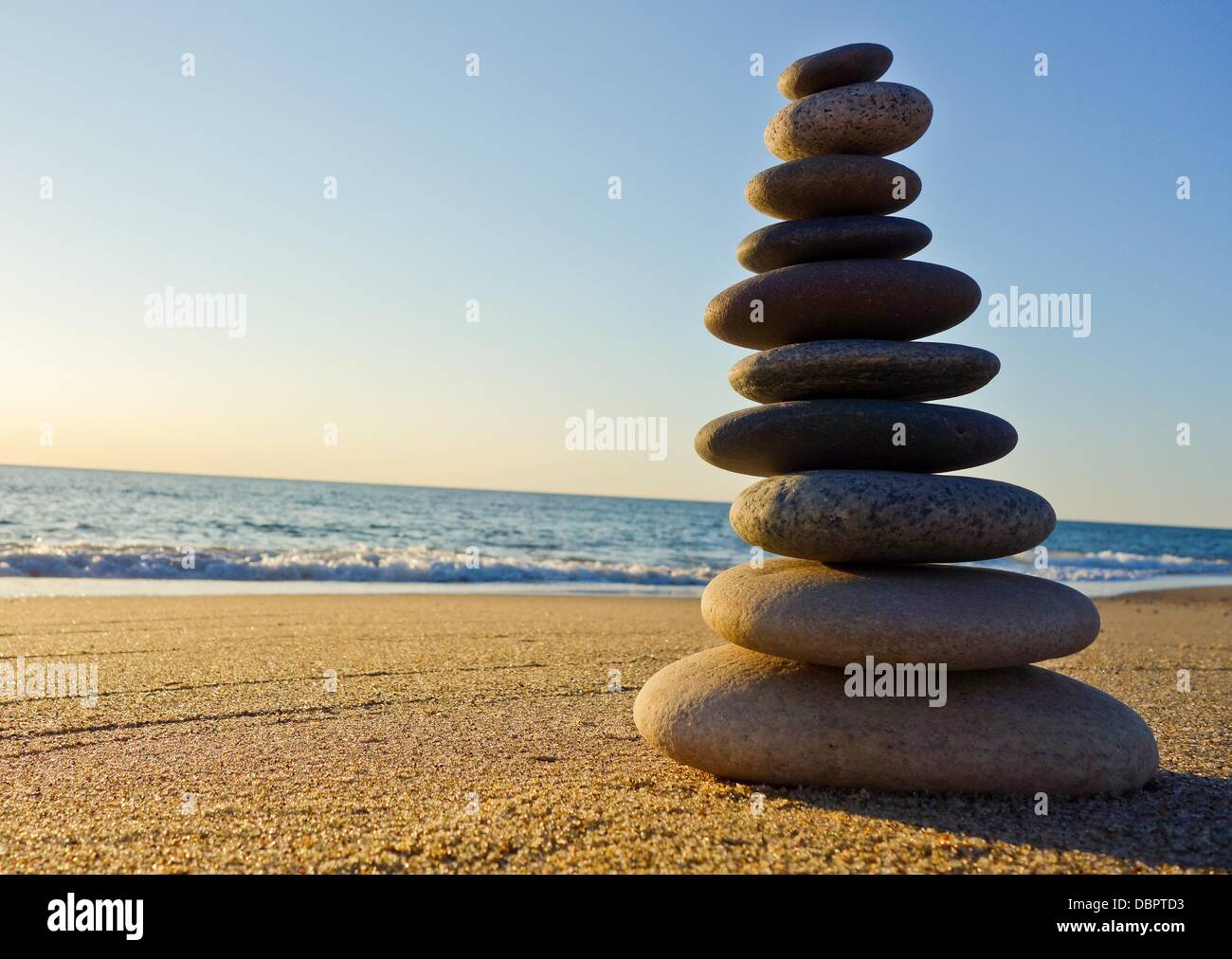 A small tower made from flat stones stands oon the beach at the North ...