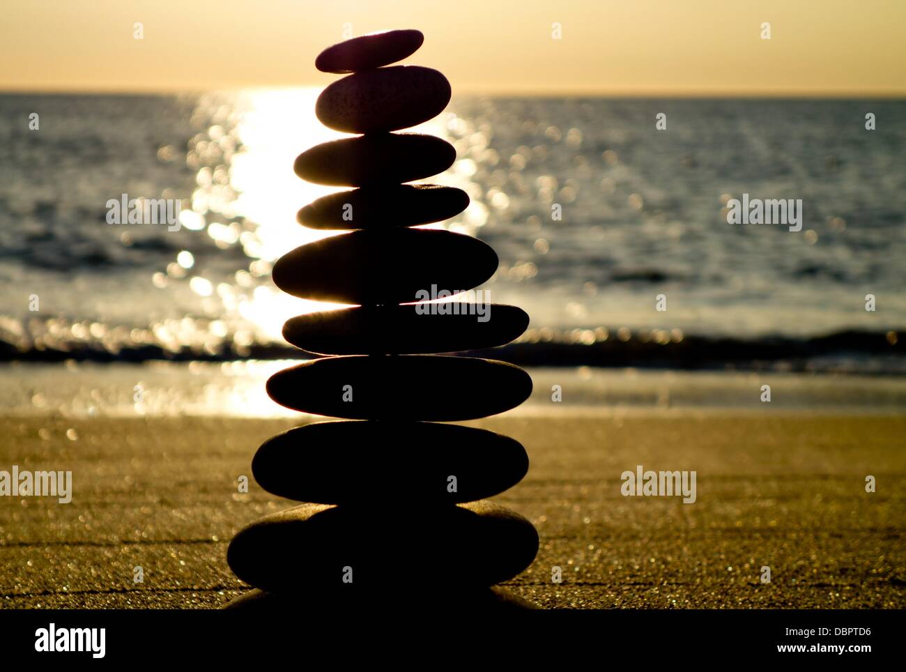 A small tower made from flat stones stands oon the beach at the North ...