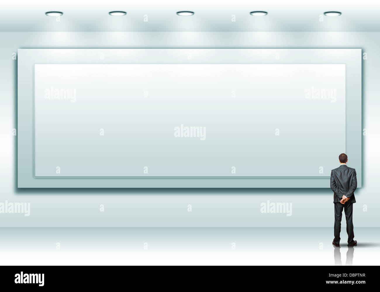 Business person standing near a blank billboard Stock Photo - Alamy