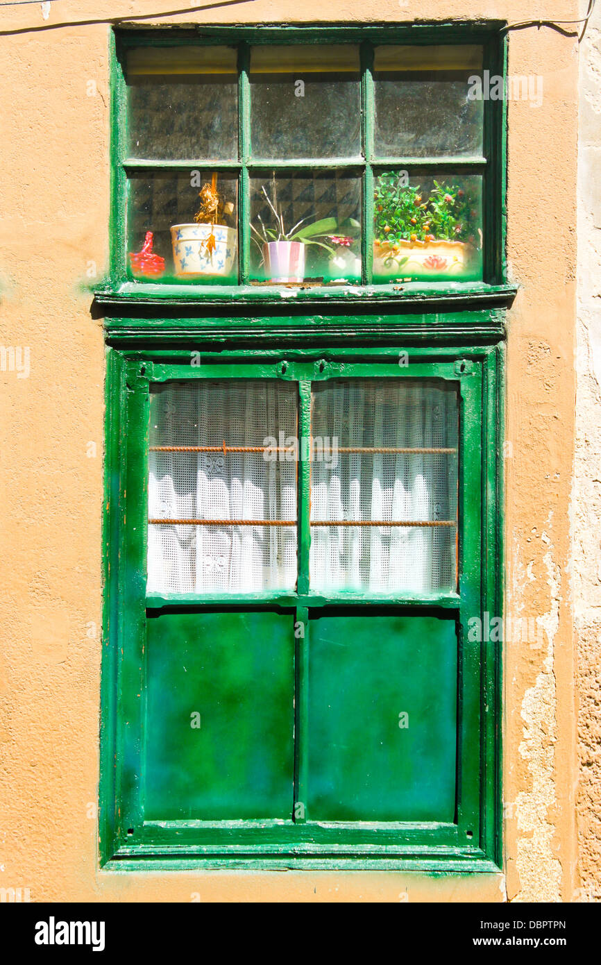 window with green frame and flowerpots Stock Photo - Alamy