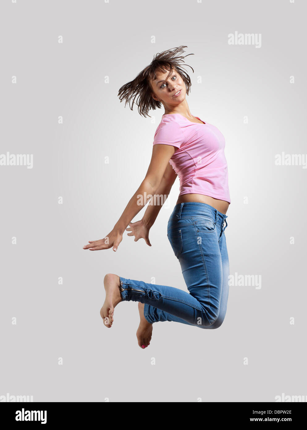 young woman dancing and jumping Stock Photo - Alamy