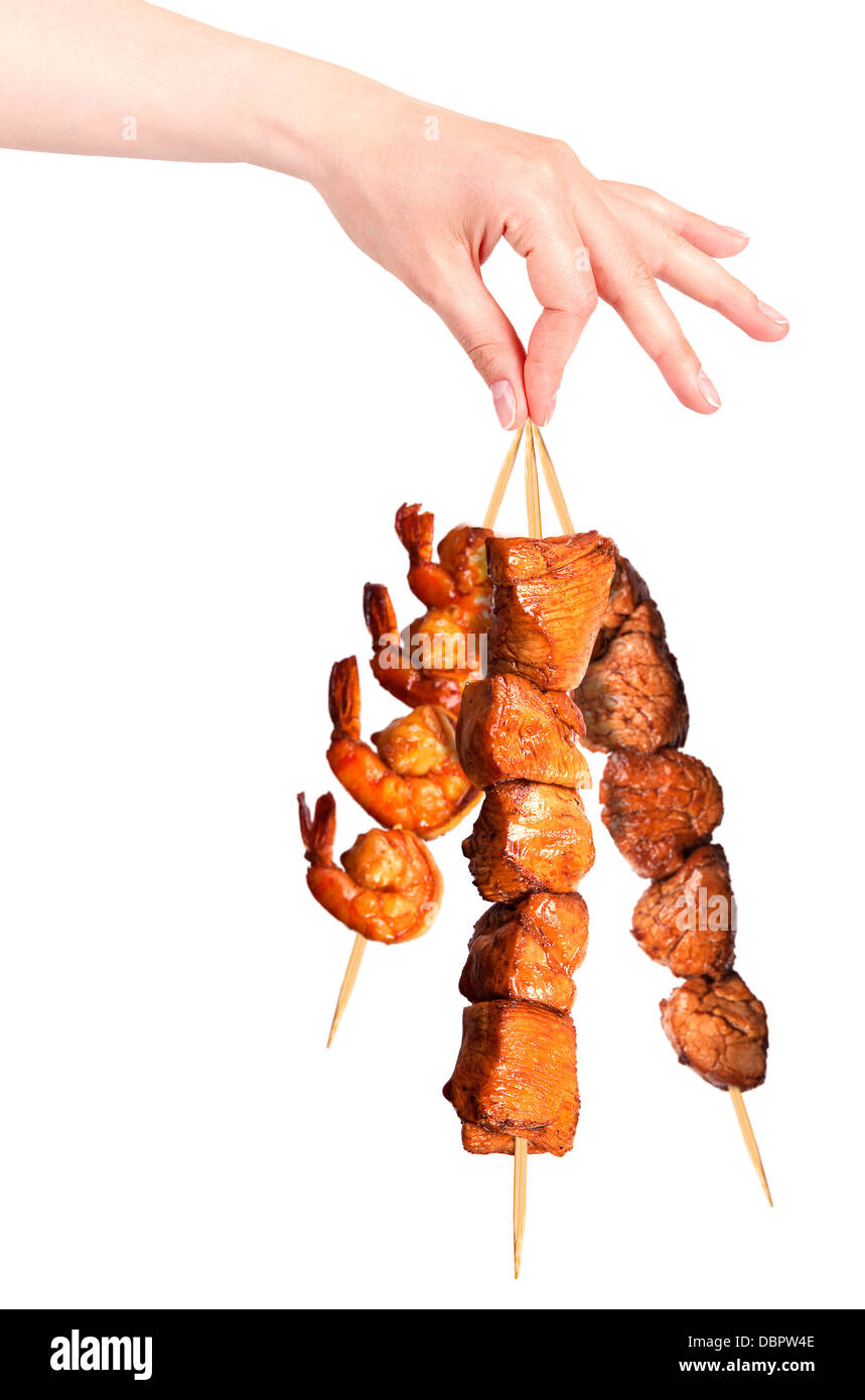 fresh grilled meat dishes with hand isolated on a white background ...