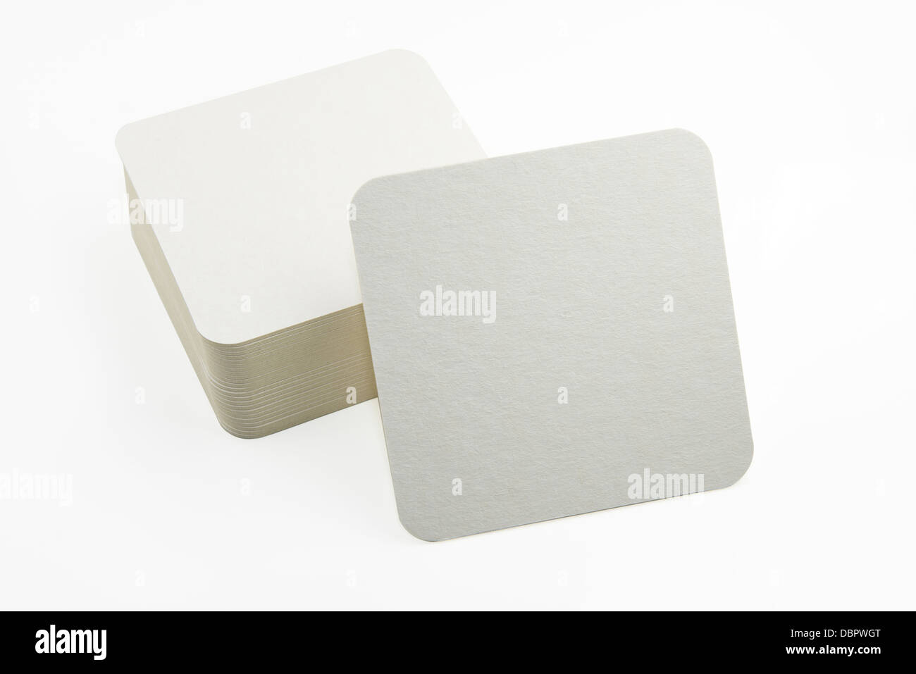 Stack of new beer coasters isolated on a white background. Add your own ...