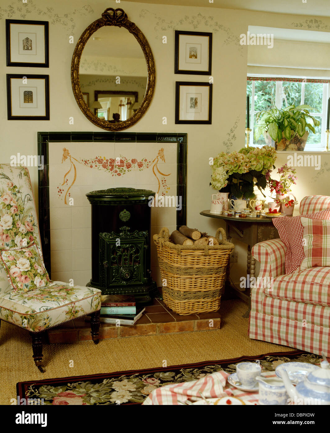 Small upholstered chair and checked armchair on either side of ...