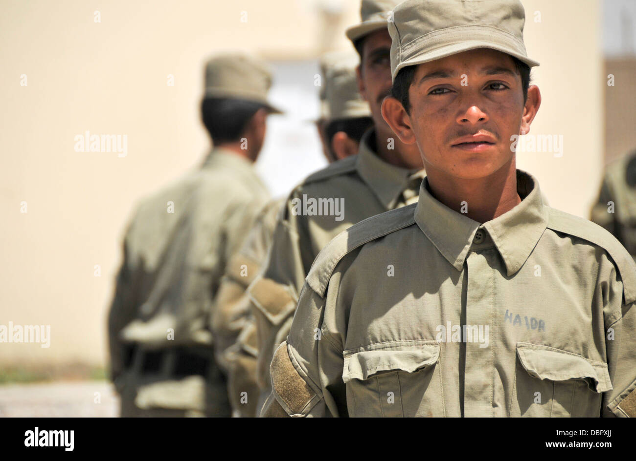 A young Afghan Local Police officer stands in formation with fellow ...