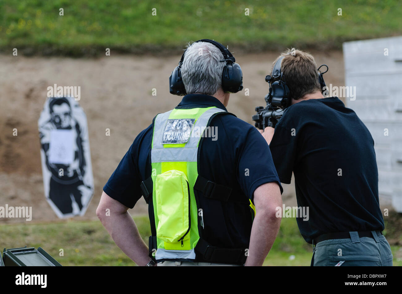 Ballykinlar, Northern Ireland. 2nd August 2013 - A man fires a Heckler ...