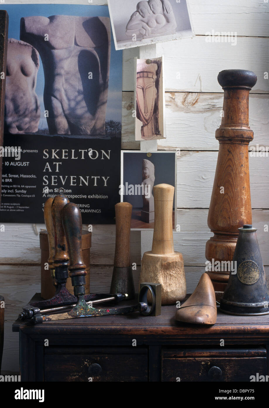 Close-up of collection of sculptor's tools on cupboard in artist's ...