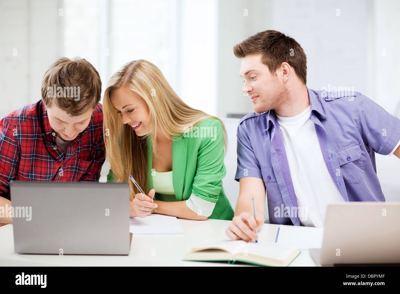 students writing something at school Stock Photo - Alamy