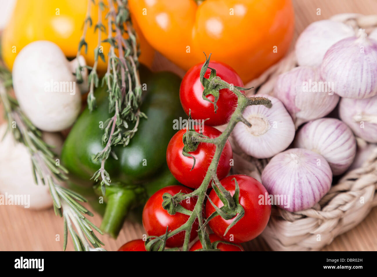 group fresh colored vegetables on wooden table Stock Photo - Alamy