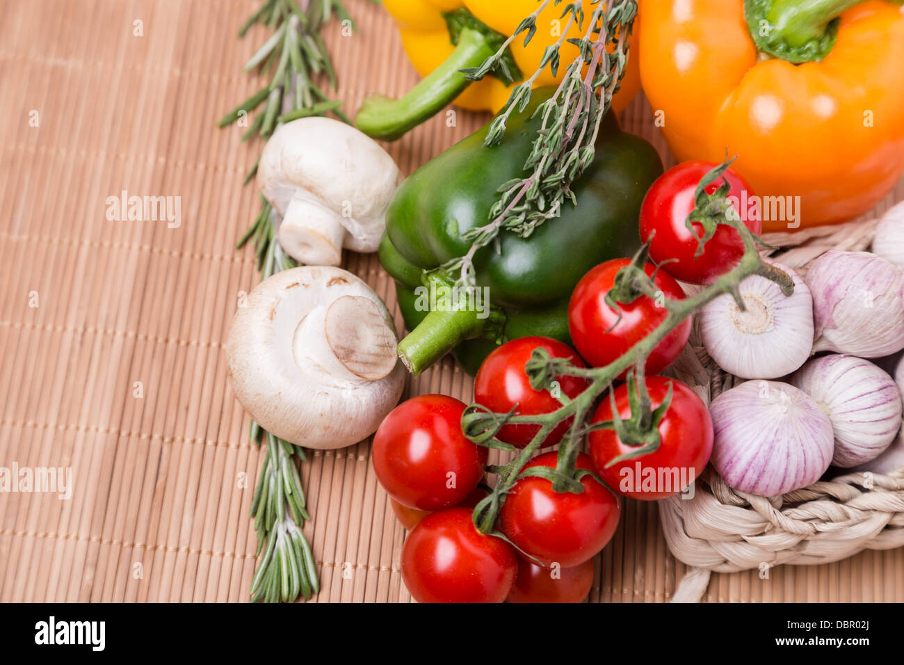 group fresh colored vegetables on wooden table Stock Photo - Alamy