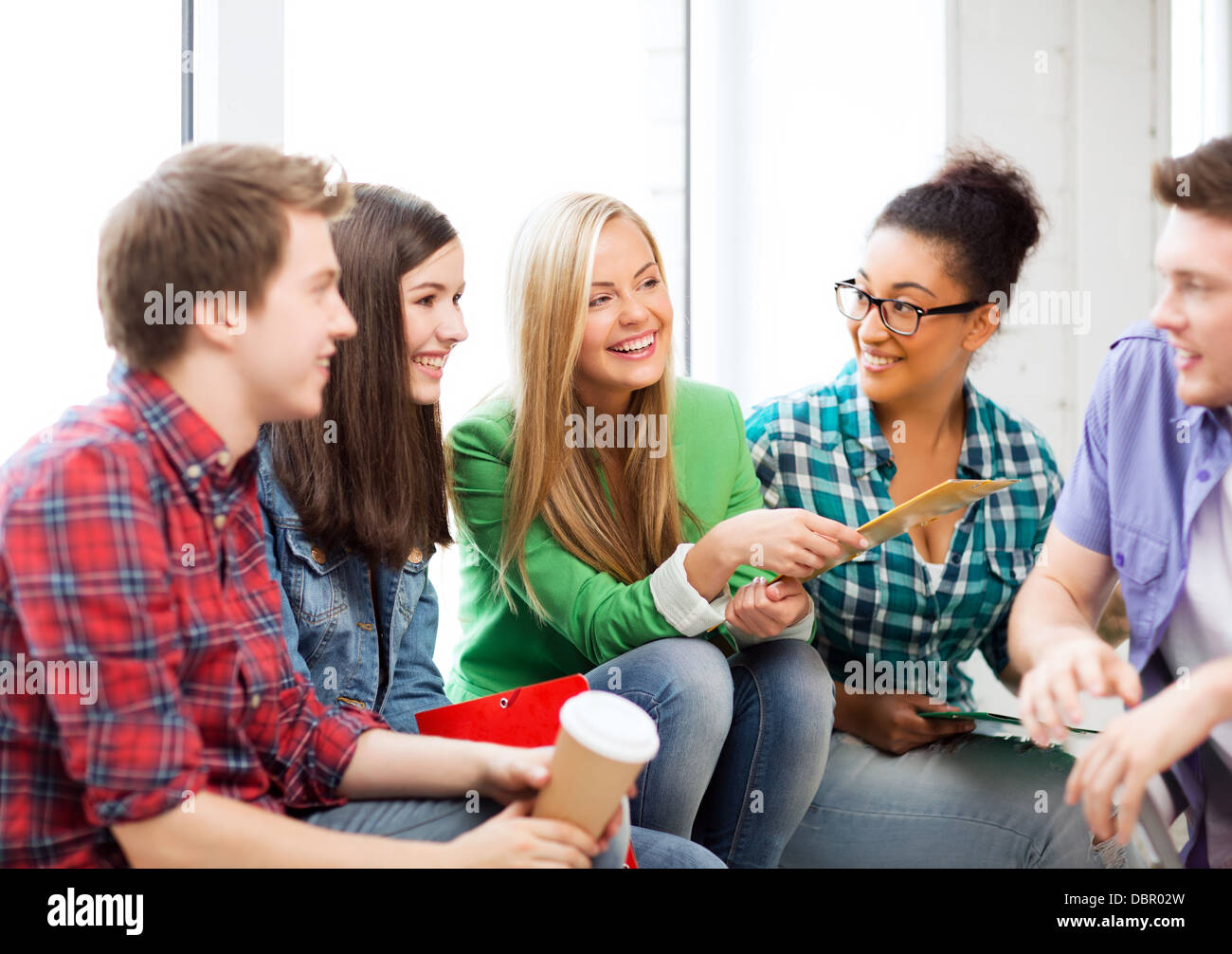 students communicating and laughing at school Stock Photo - Alamy