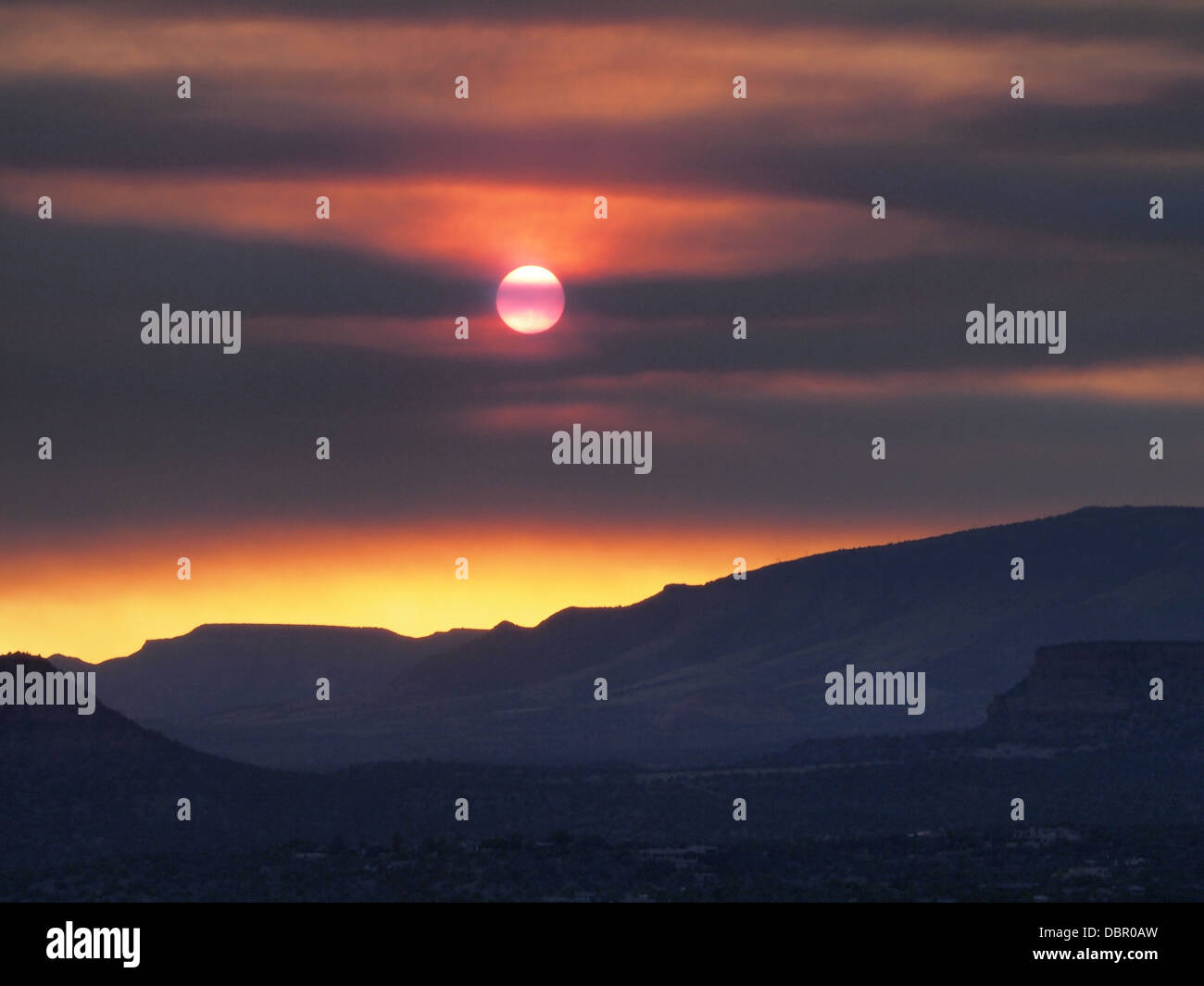 Sunset through smoke from a fire hi-res stock photography and images ...