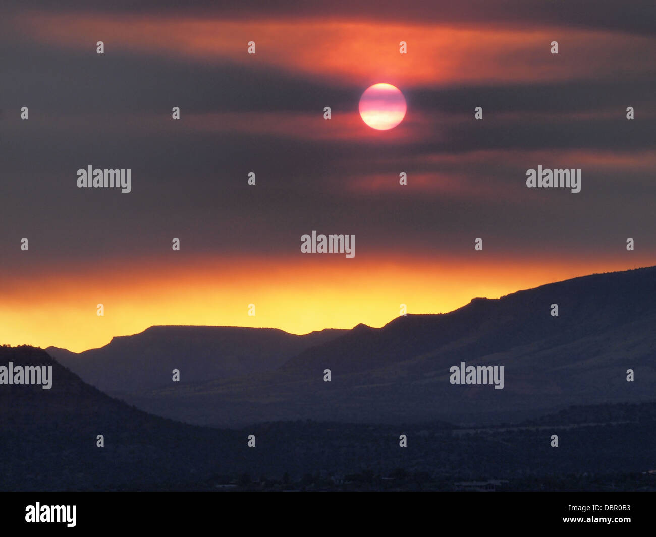 Sunset through smoke from a fire hi-res stock photography and images ...