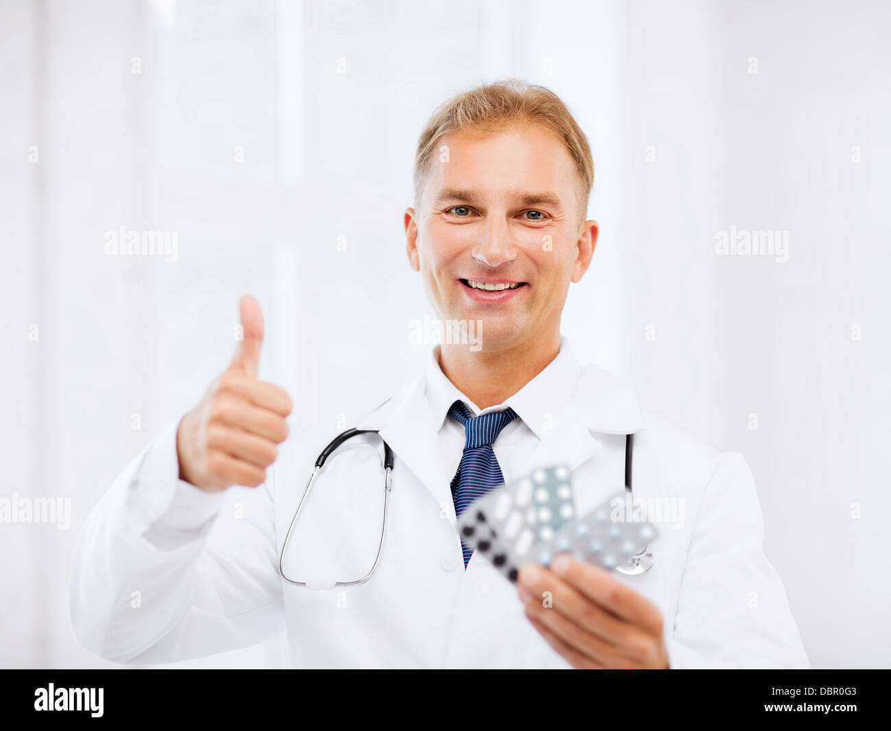 male doctor with packs of pills Stock Photo - Alamy