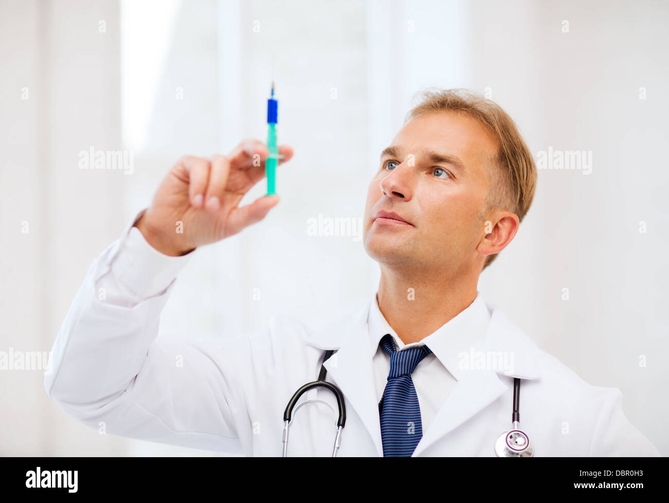 male doctor holding syringe with injection Stock Photo - Alamy