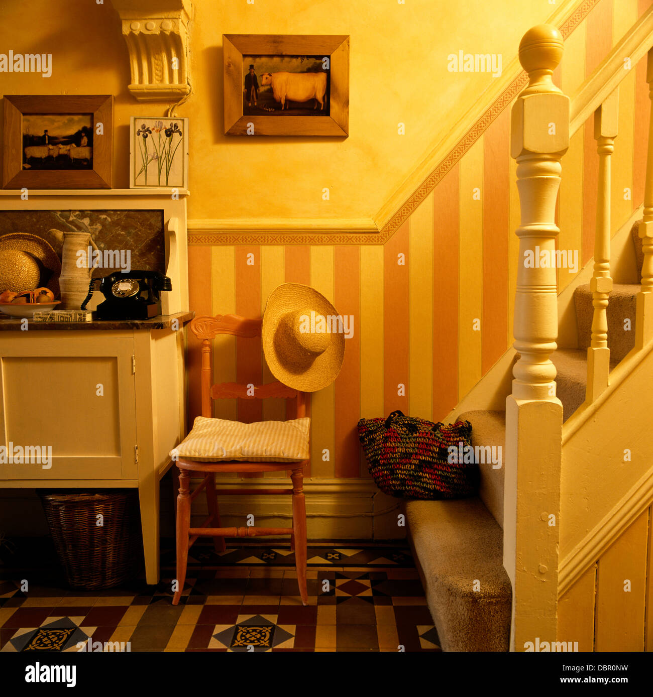 Painted orange striped dado above stairs in small hall with sponge ...