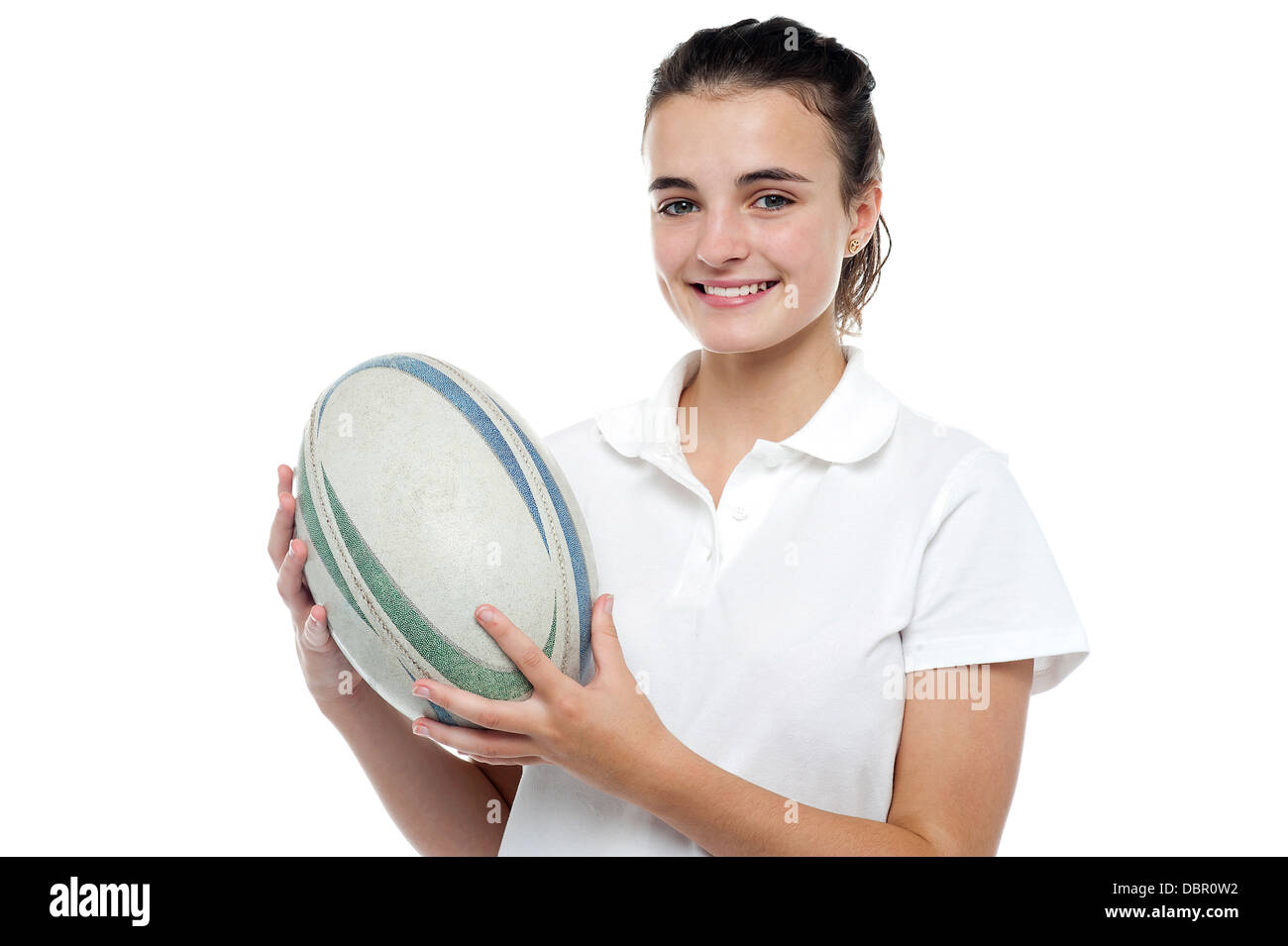Attractive sporty girl posing with rugby ball Stock Photo - Alamy