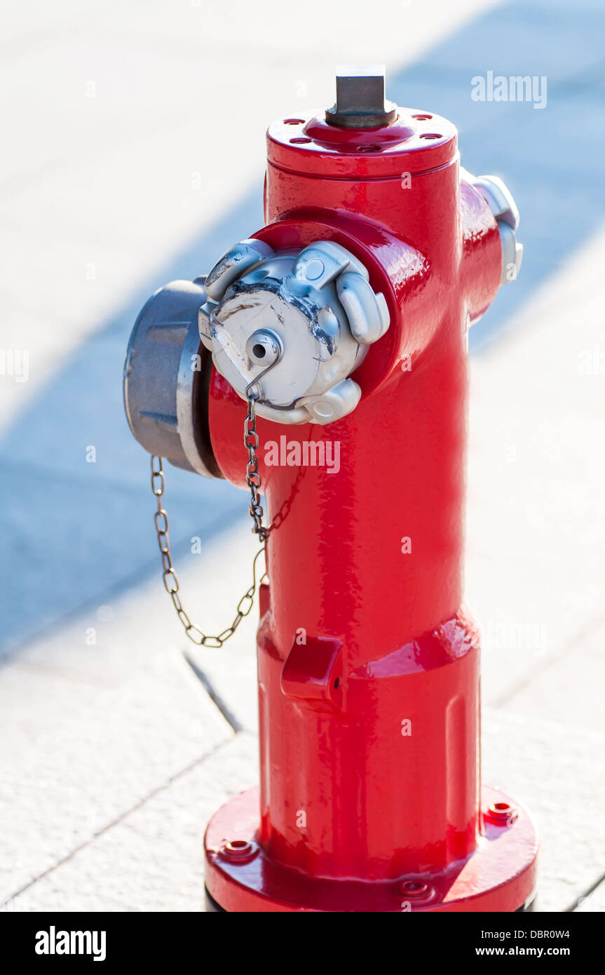 Detail of a Red fire hydrant on the street Stock Photo - Alamy
