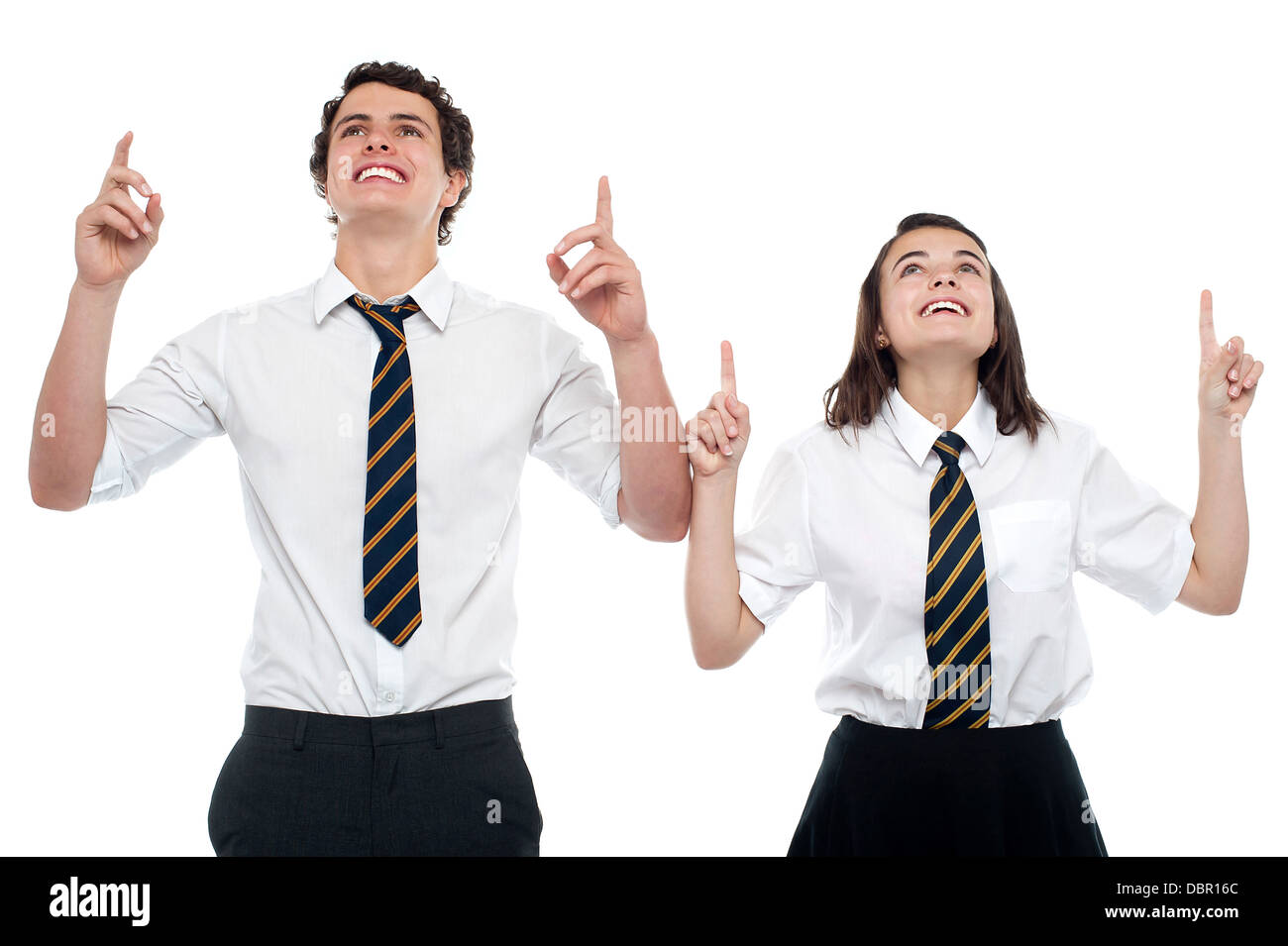 Schoolmates looking and pointing upwards Stock Photo - Alamy