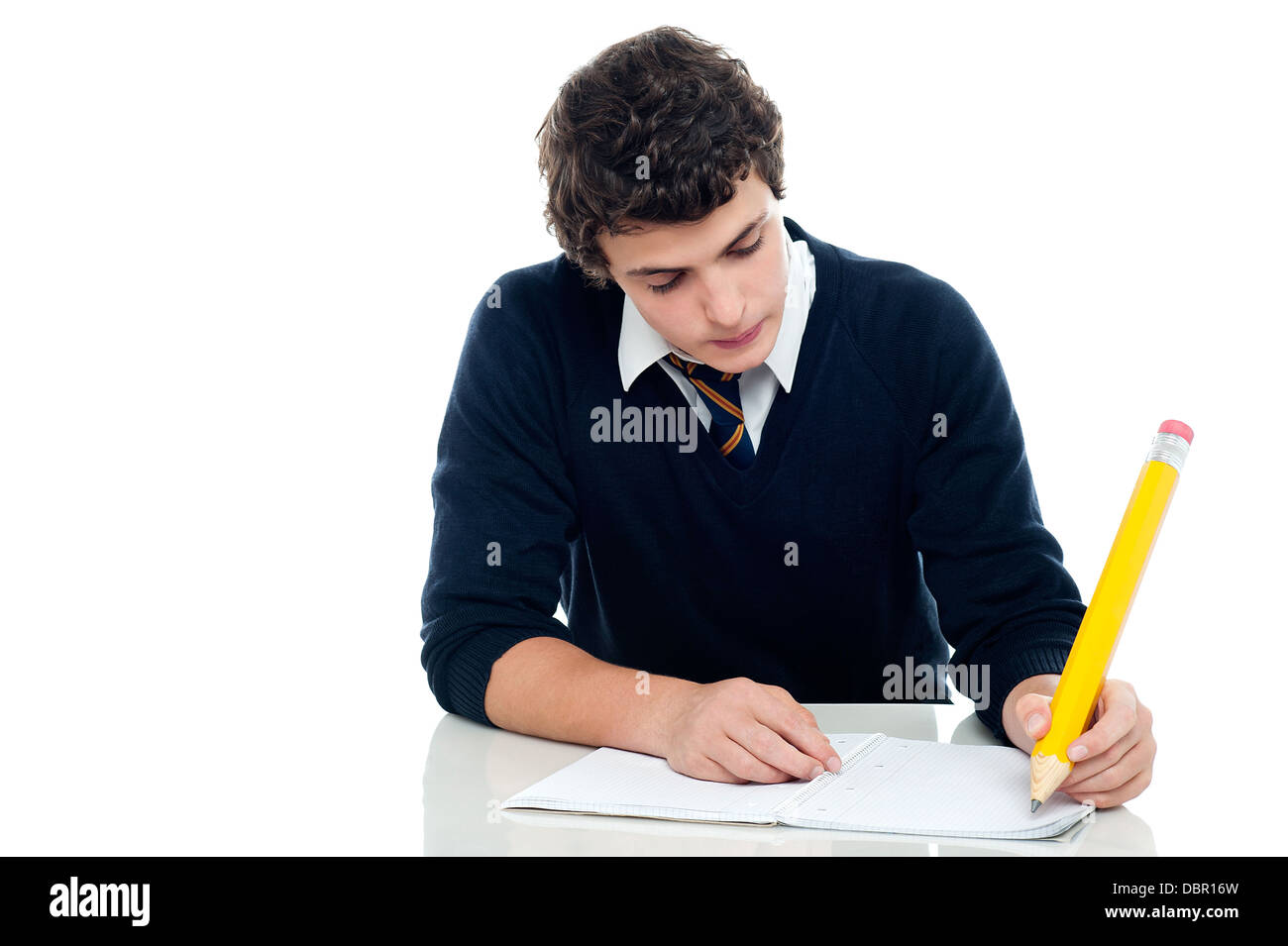 Young schoolboy taking up his test at school Stock Photo - Alamy