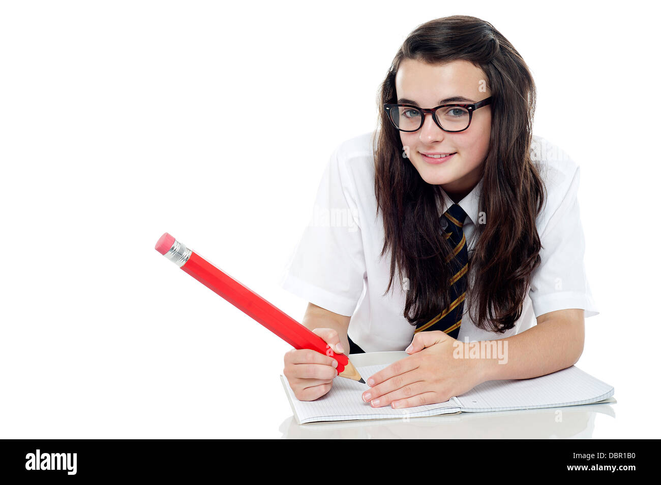 Bespectacled schoolgirl with long hair studying Stock Photo - Alamy