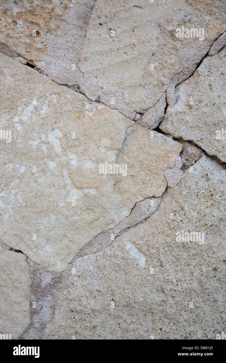 Chunky rocks with cracks in a wall for background Stock Photo - Alamy