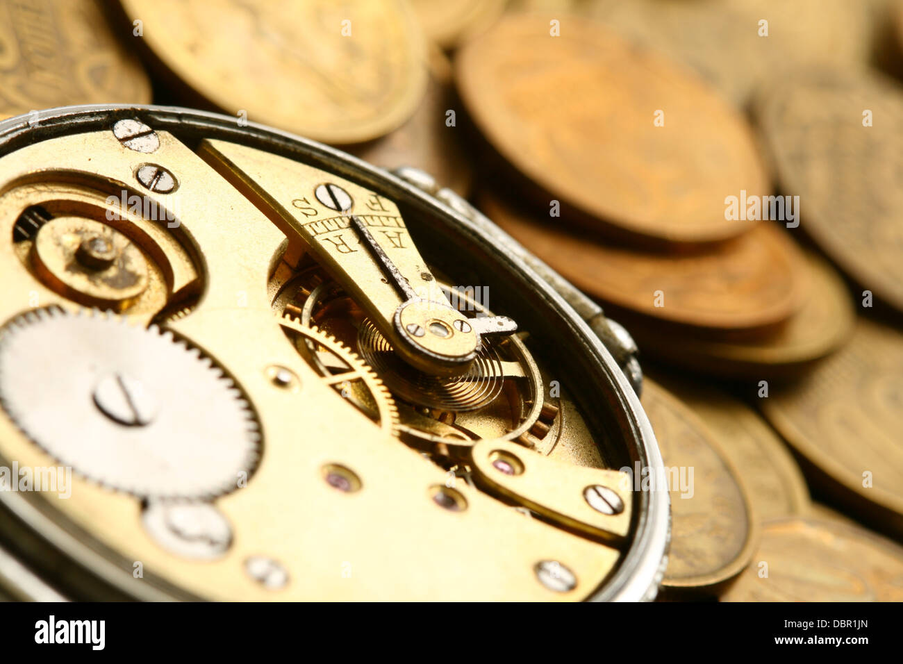 time is money coins and clock macro concet Stock Photo - Alamy