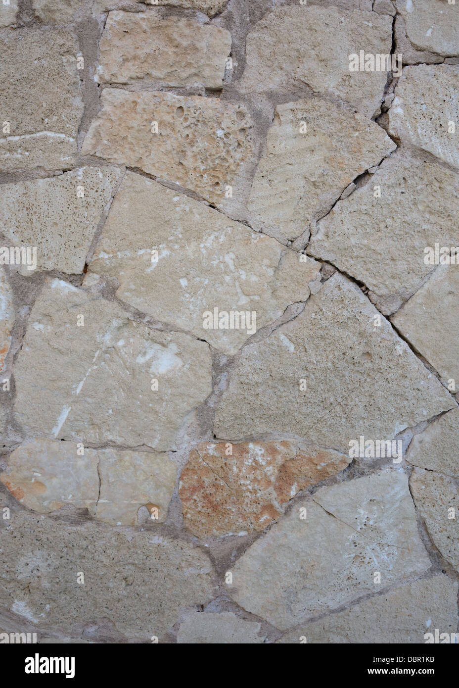 Chunky rocks with cracks in a wall for background Stock Photo - Alamy