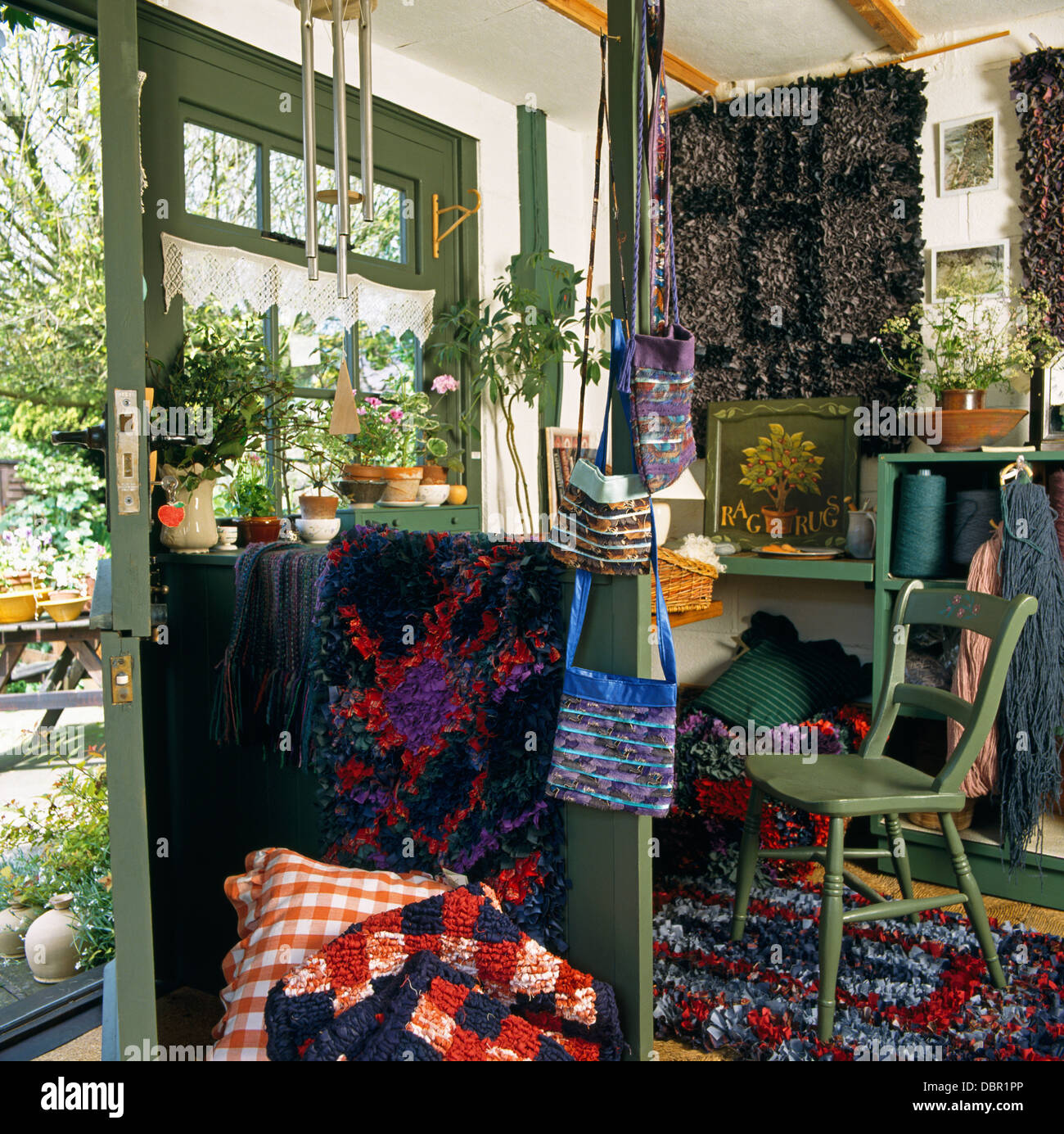 Hand made crochet and tatting rugs in workroom in converted shed Stock ...