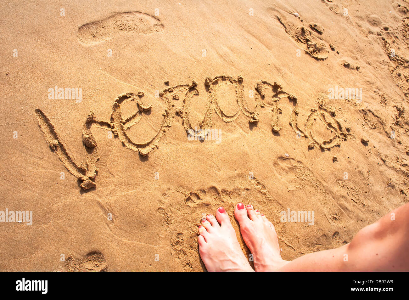 Summer written in sand on the beach Stock Photo - Alamy