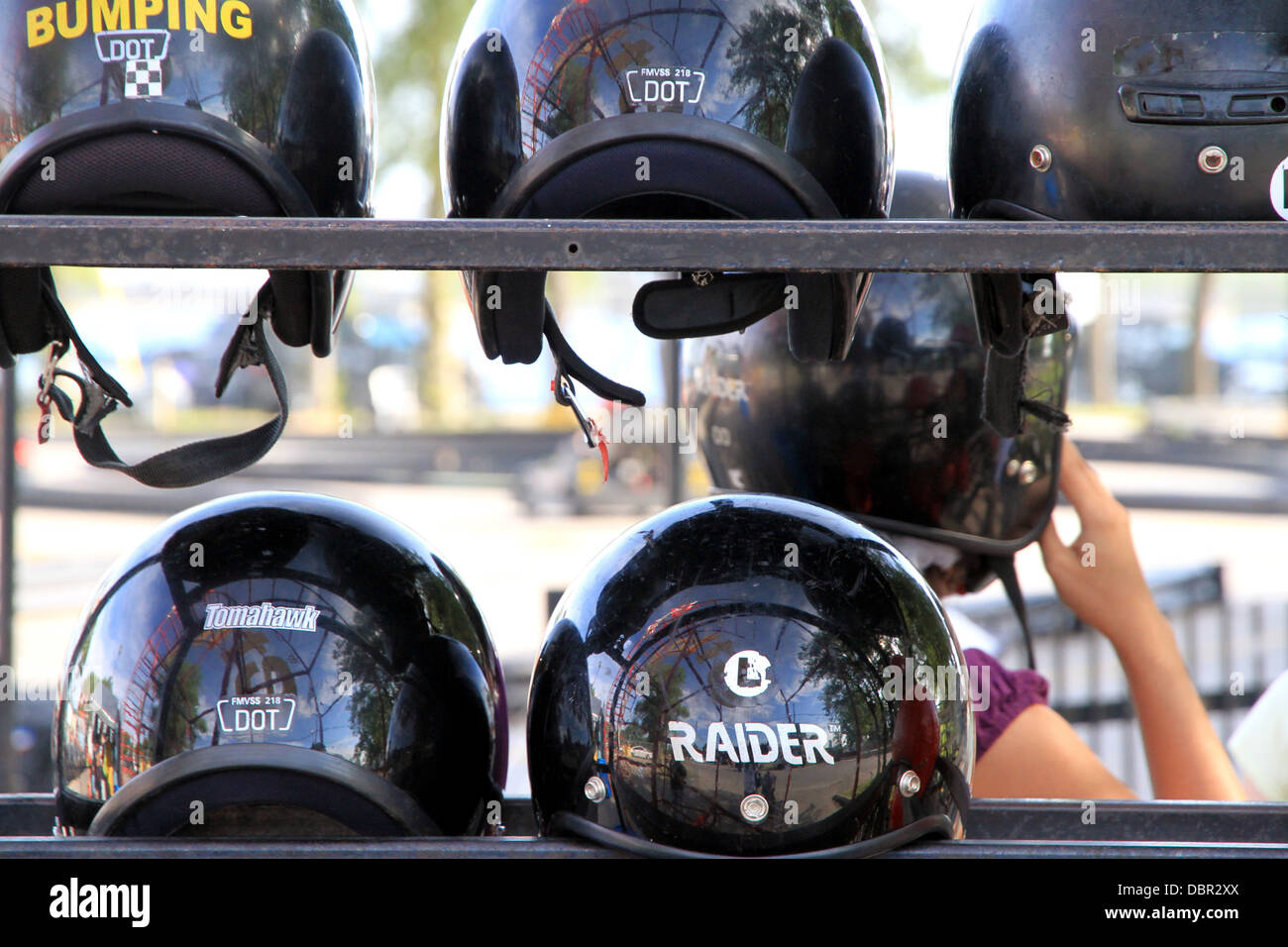 Go-kart helmets on a rack at a circuit in Toronto, Canada Stock Photo ...
