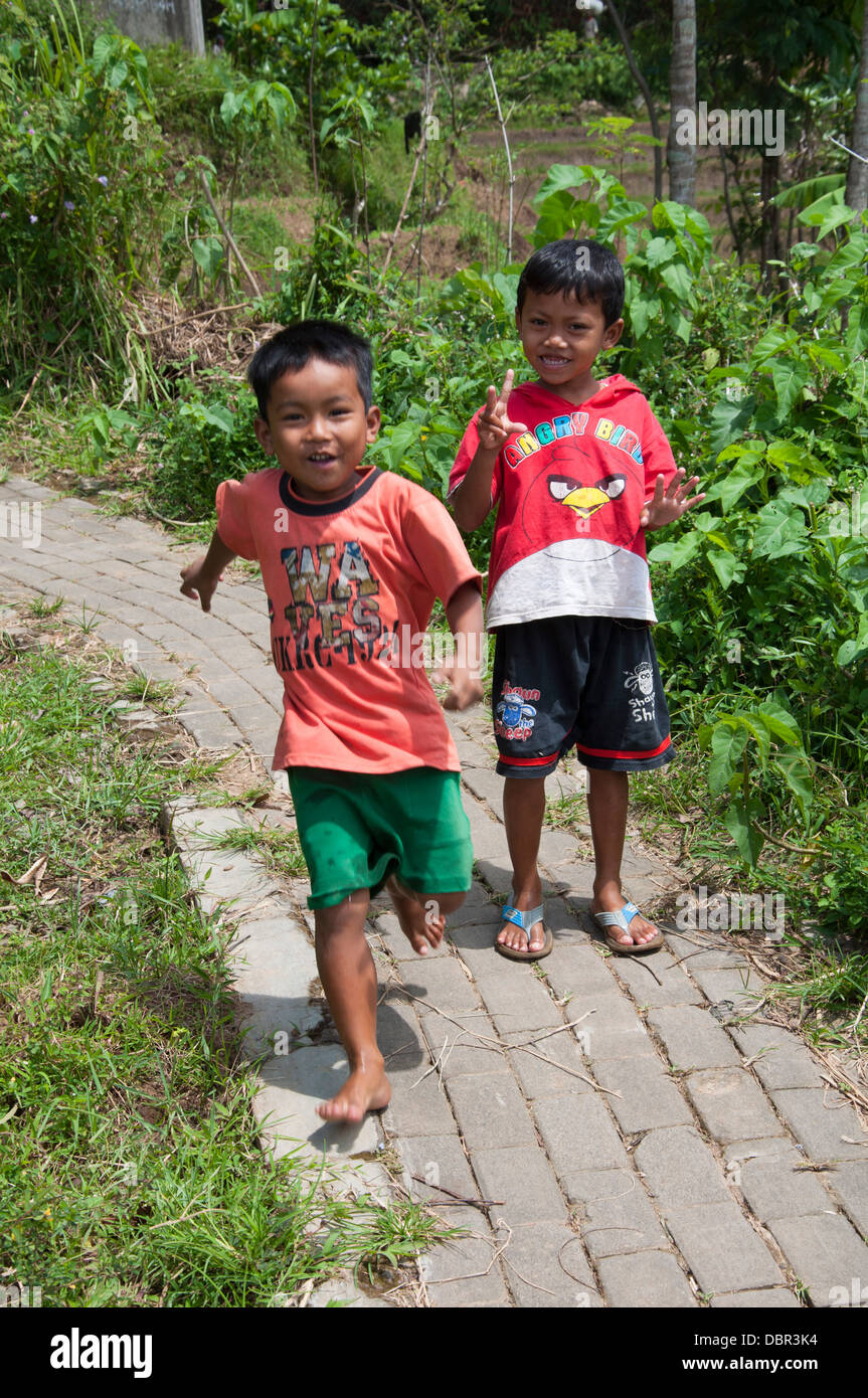 Kids running happily Stock Photo - Alamy