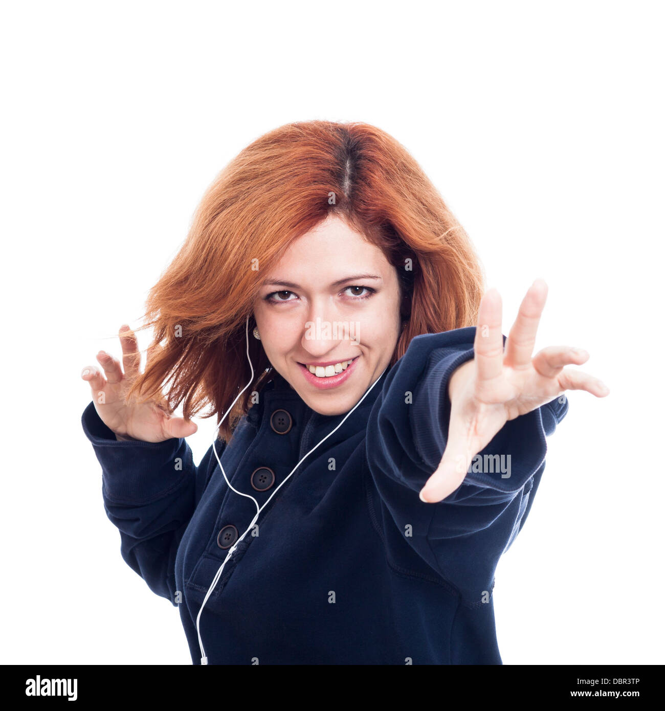 Ecstatic woman with earphones enjoying music, isolated on white ...