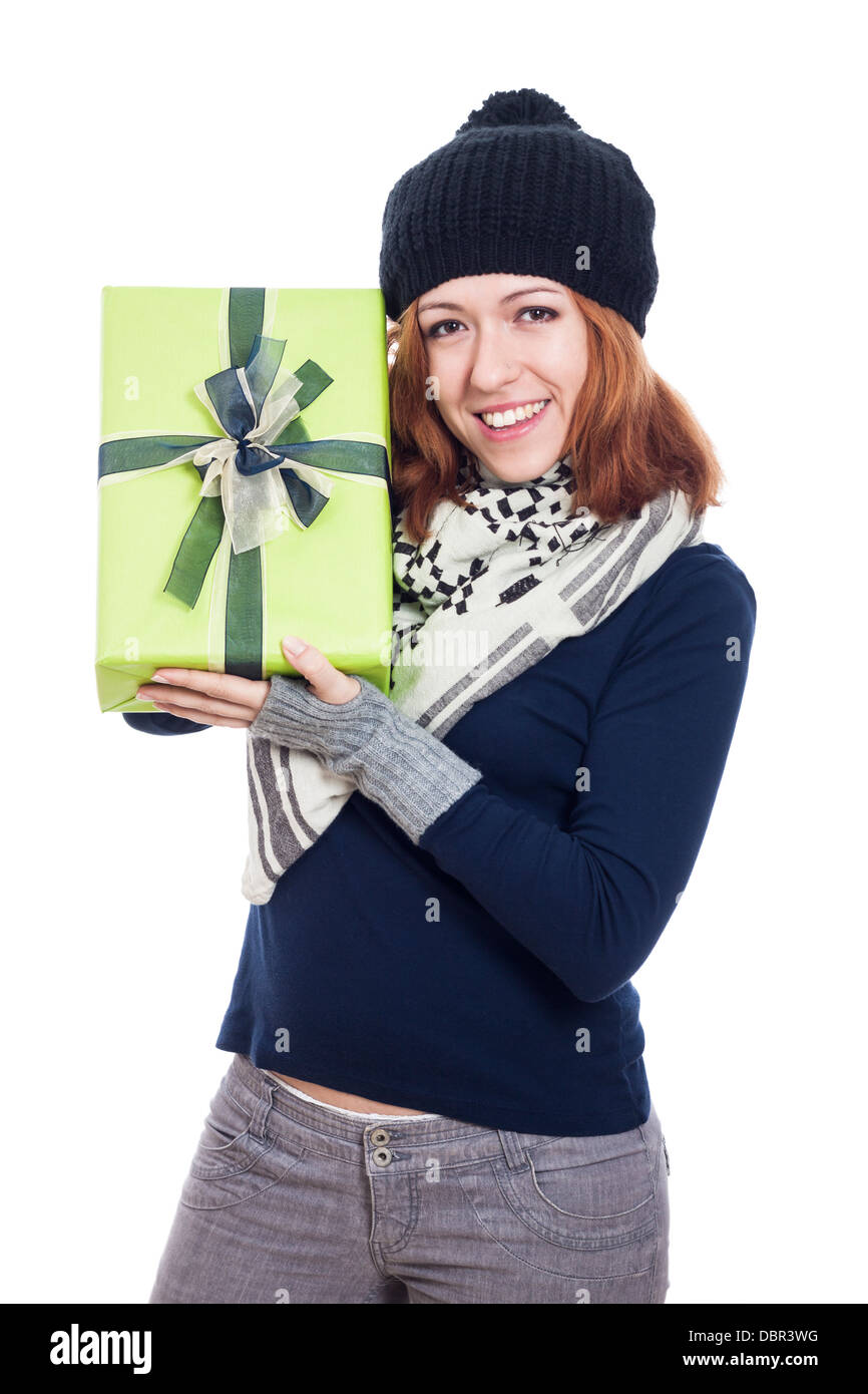 Ecstatic happy winter woman holding present, isolated on white ...