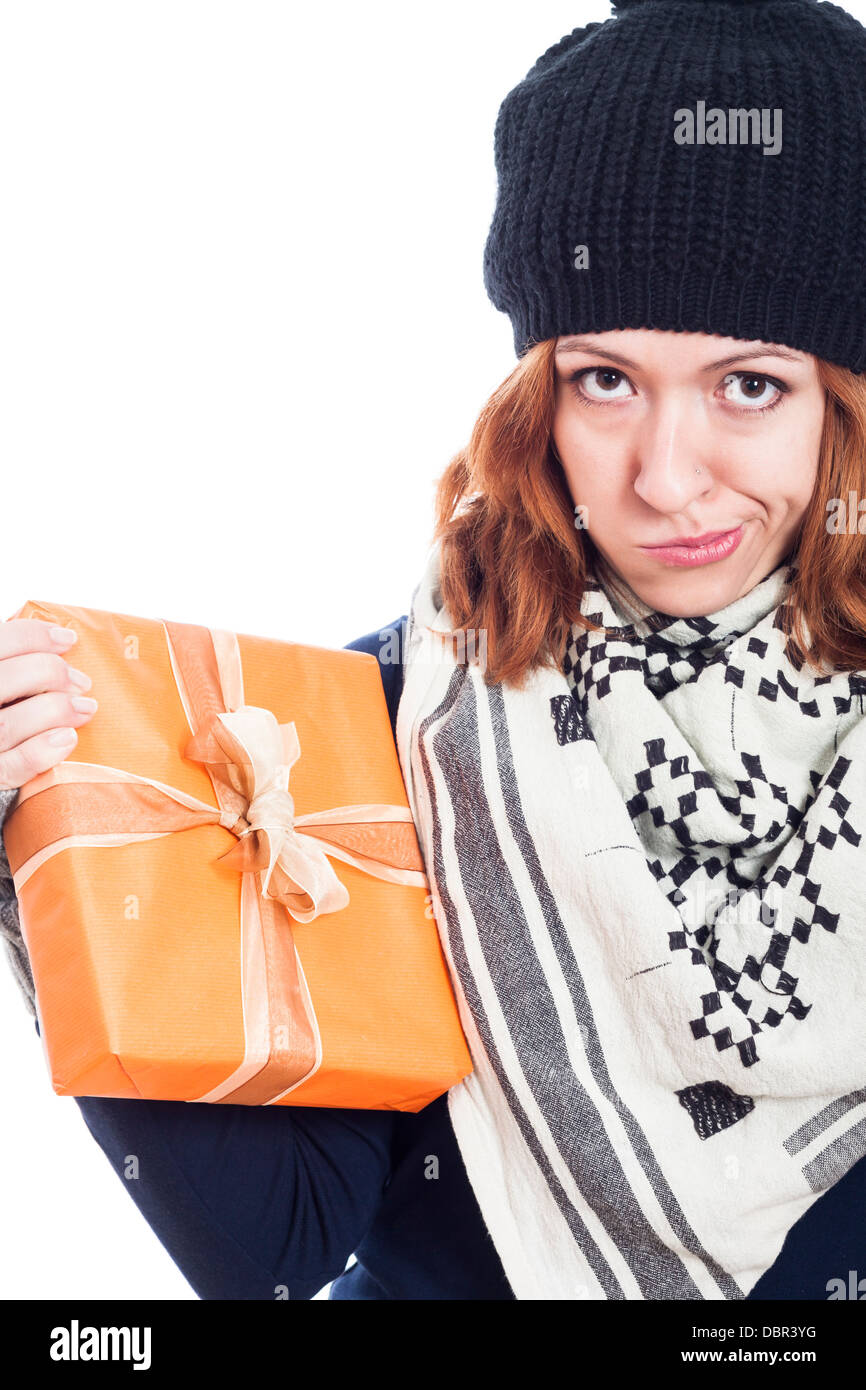 Disappointed woman holding present, isolated on white background Stock ...