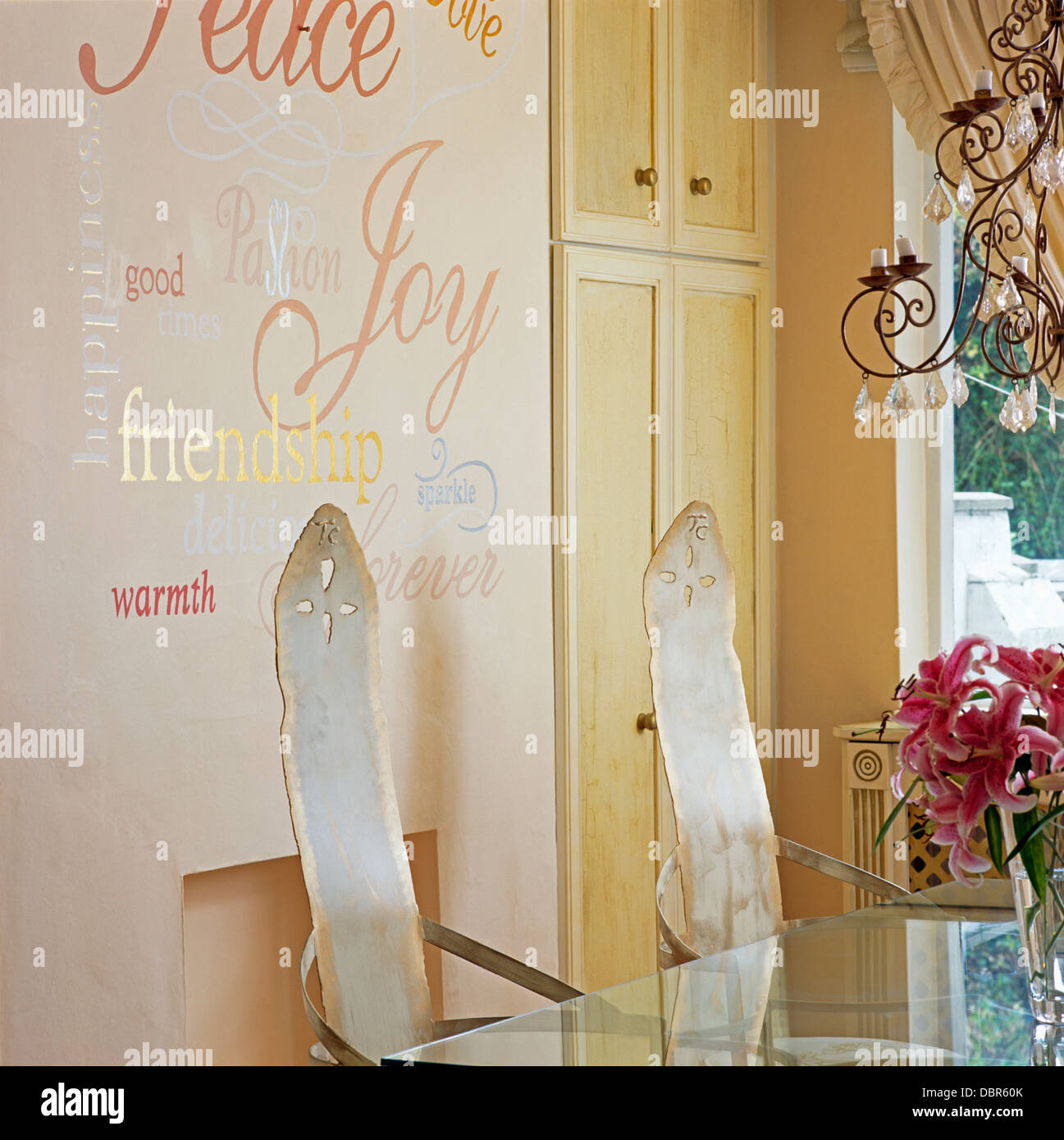 Close-up of metal chairs in dining room with hand-written lettering on ...