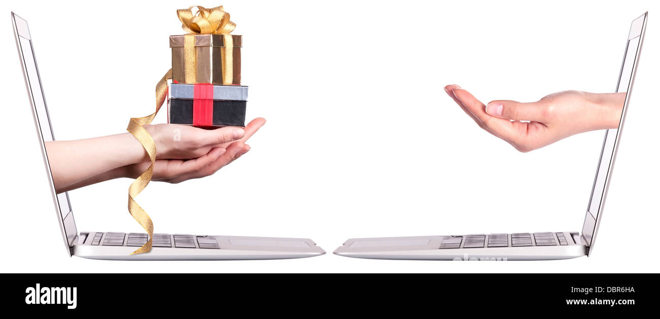 hand with a gift come out from a screen of a laptop computer isolated ...