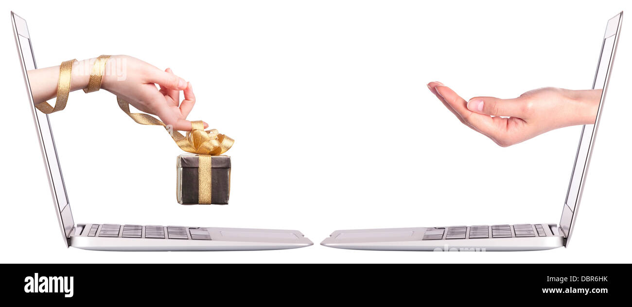 hand with a gift come out from a screen of a laptop computer isolated ...