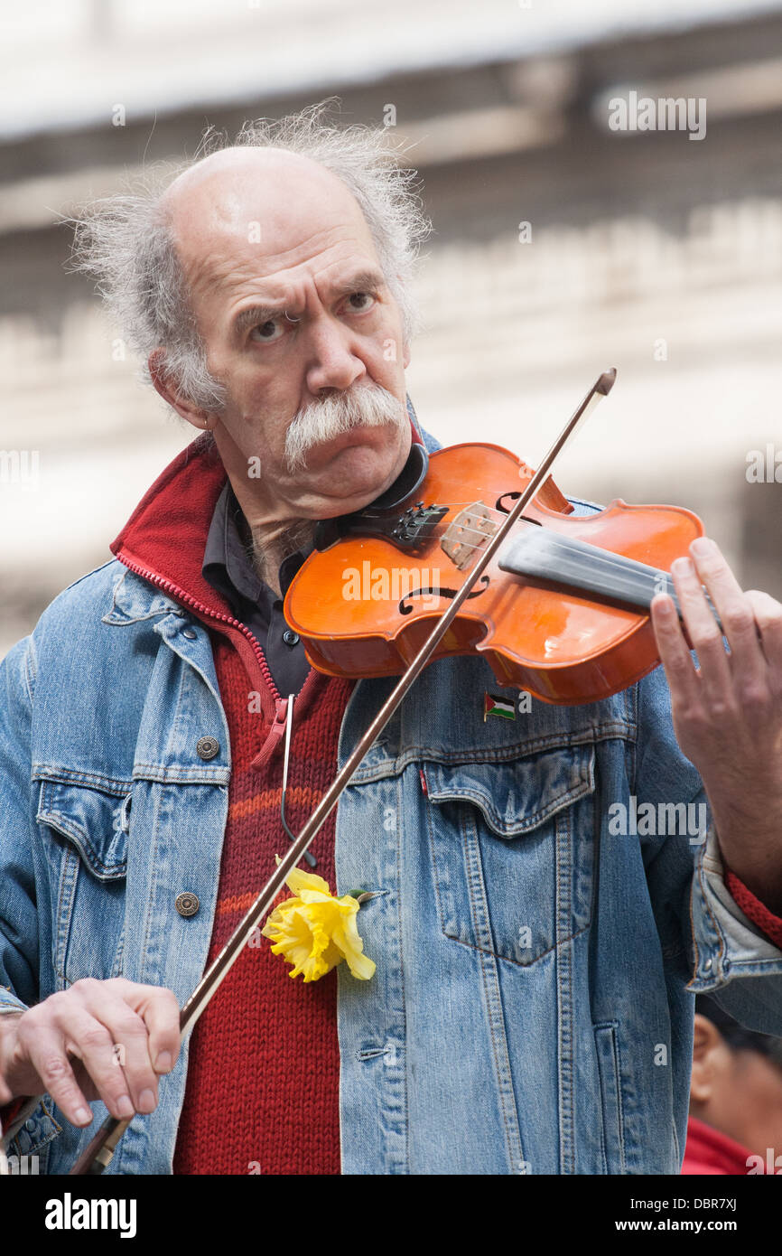 Ed Emery playing violin at G20 summit Protest outside the Bank of ...