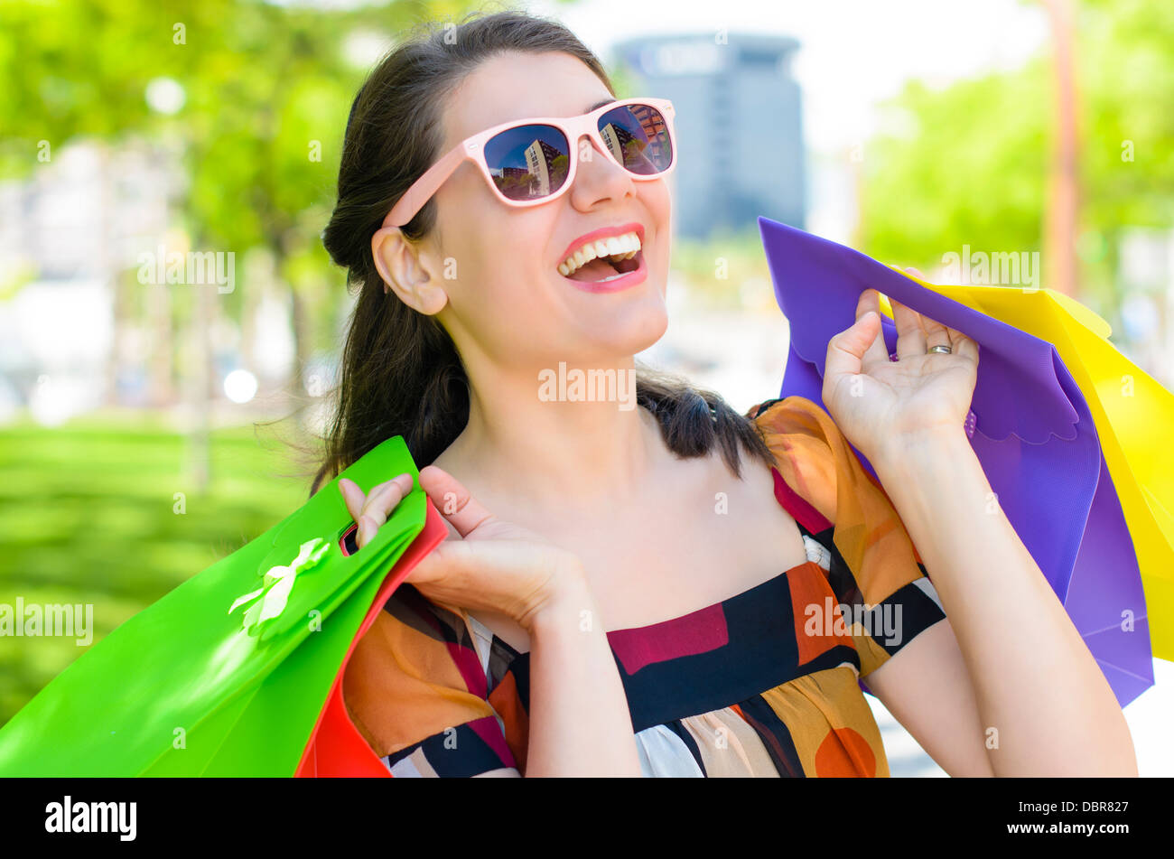 A cute girl coming happy from shopping Stock Photo - Alamy