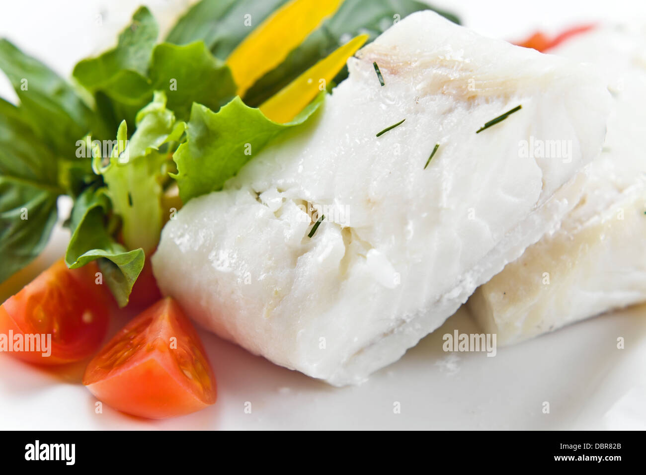 Halibut with greens and vegetables Stock Photo - Alamy