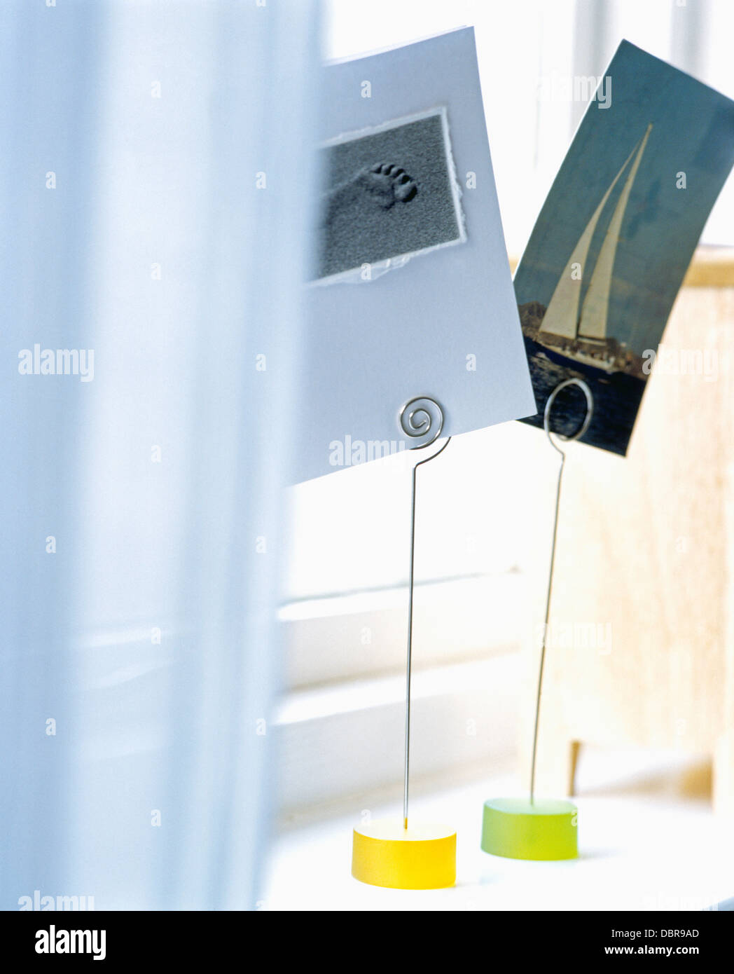 Close-up of cards on single metal+perspex card holders Stock Photo - Alamy