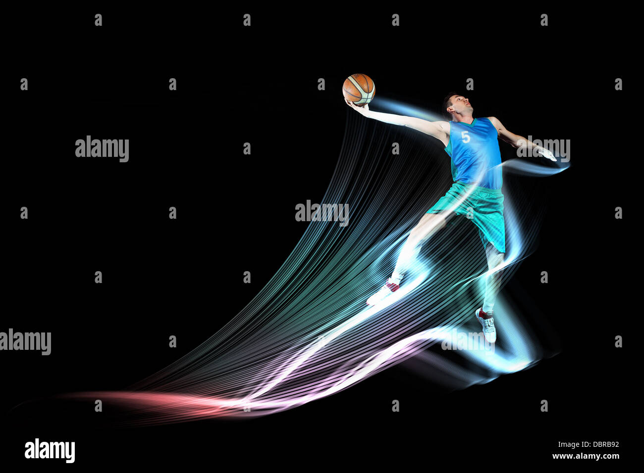 Basketball player with a ball Stock Photo - Alamy