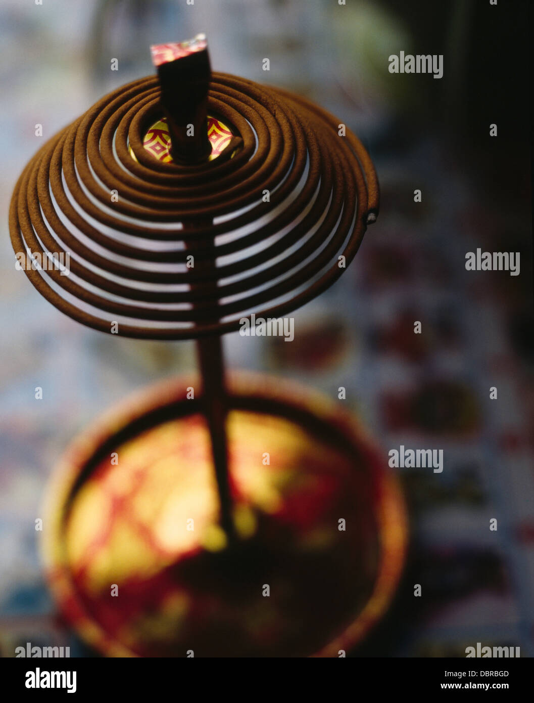 Close-up of coiled incense in burner Stock Photo - Alamy