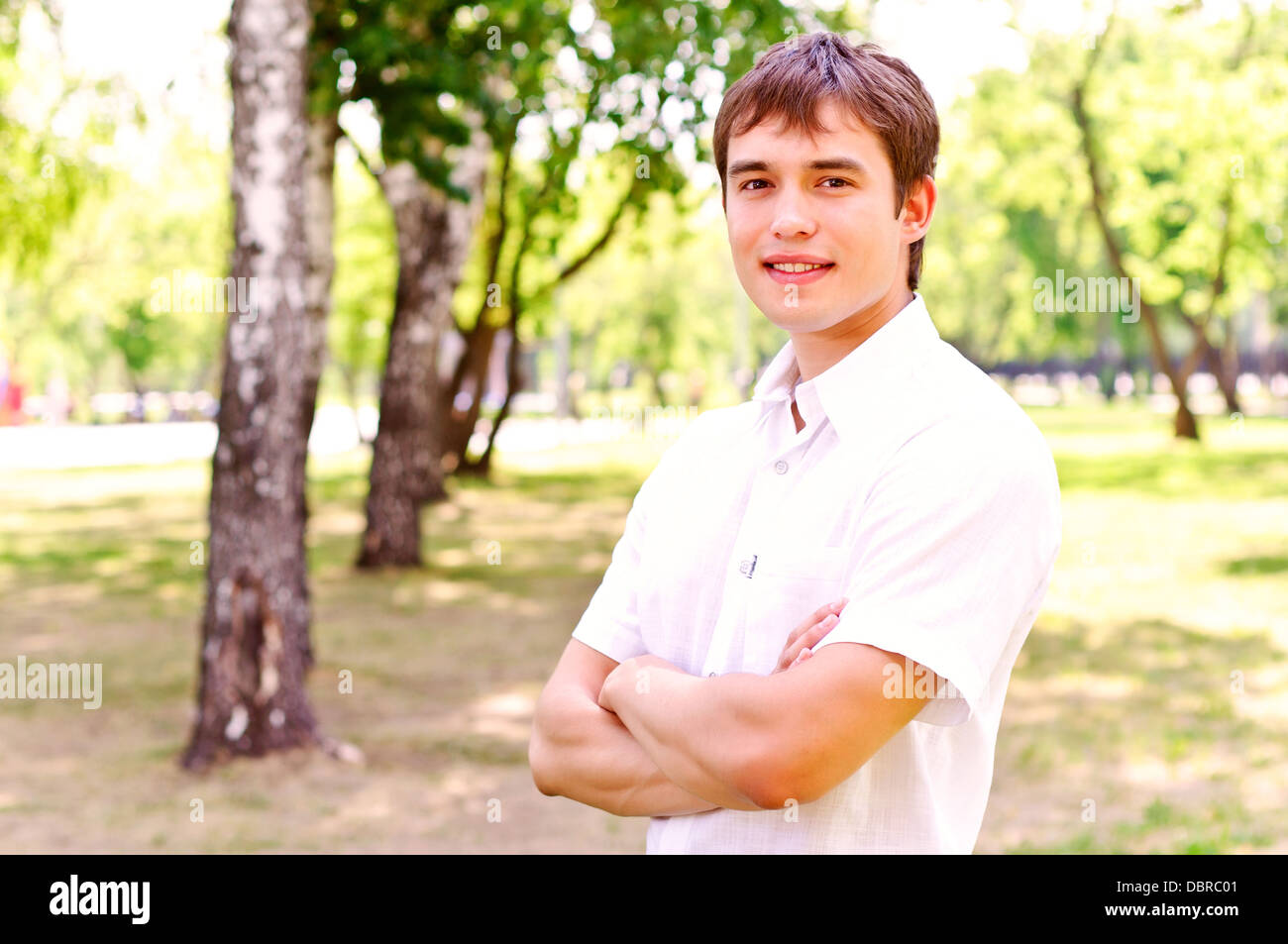 Portrait of man outside in park Stock Photo - Alamy