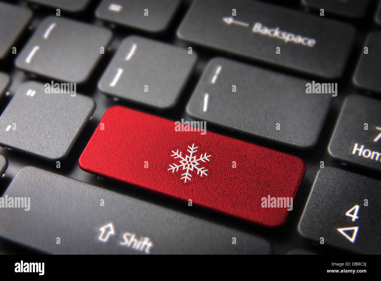 Red keyboard key with snow icon, season background Stock Photo - Alamy