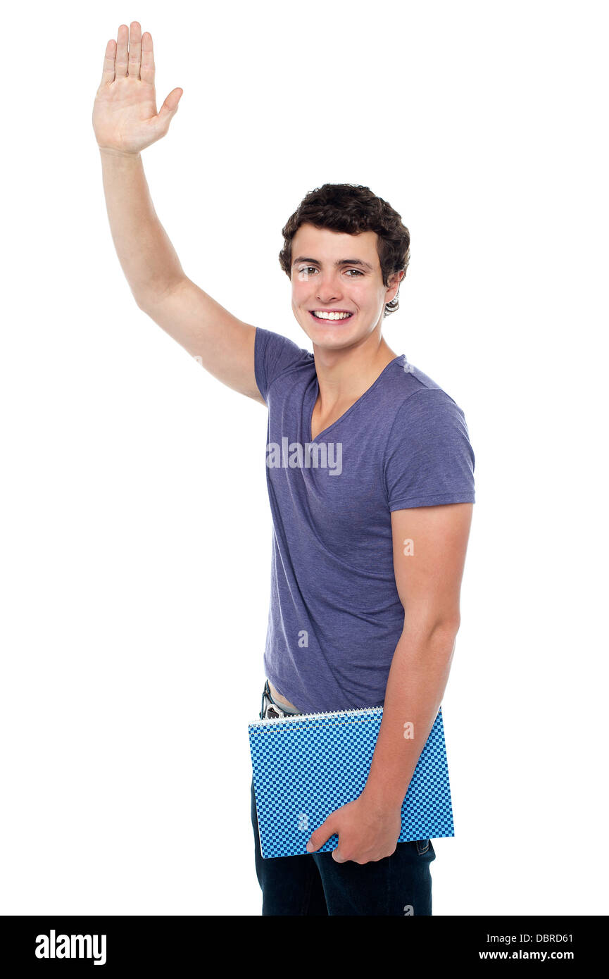 Handsome young guy putting his right hand up Stock Photo - Alamy
