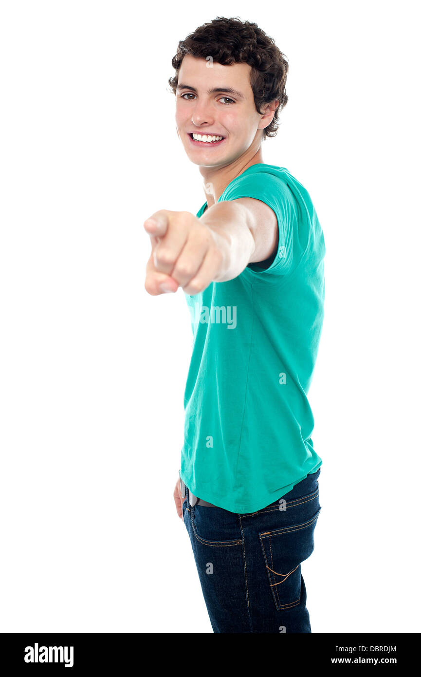 Young guy pointing out stretched hi-res stock photography and images ...